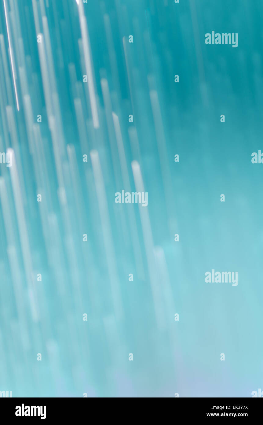 blurred falling water drops blue background Stock Photo - Alamy