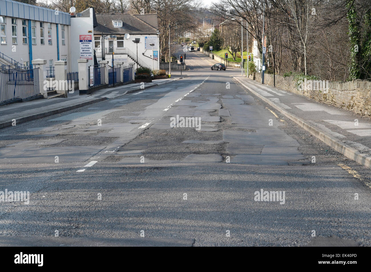 Uneven poor quality road surface patched repairs, Archer road in ...