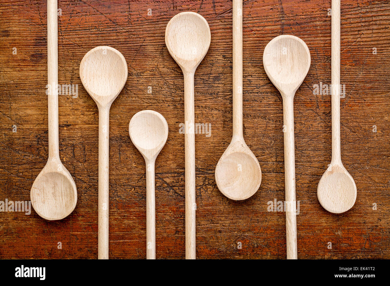 set of wooden spoons against grunge rustic wood Stock Photo - Alamy