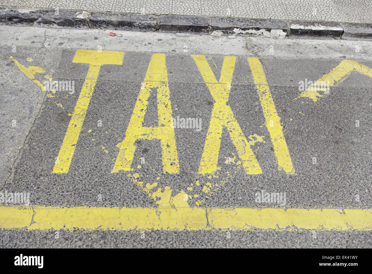 Taxi sign on asphalt, detail of a traffic signal, information and ...