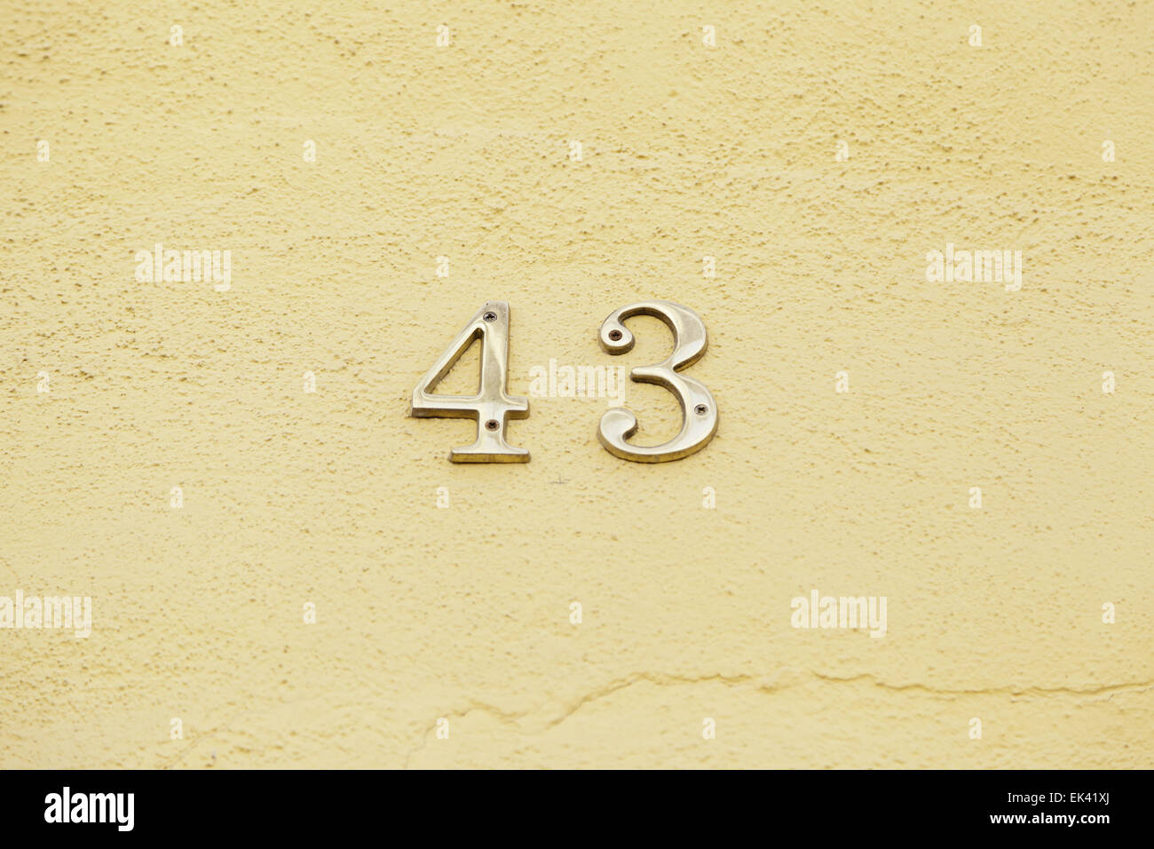 Number forty-three on the wall of a house, detail of a number of ...