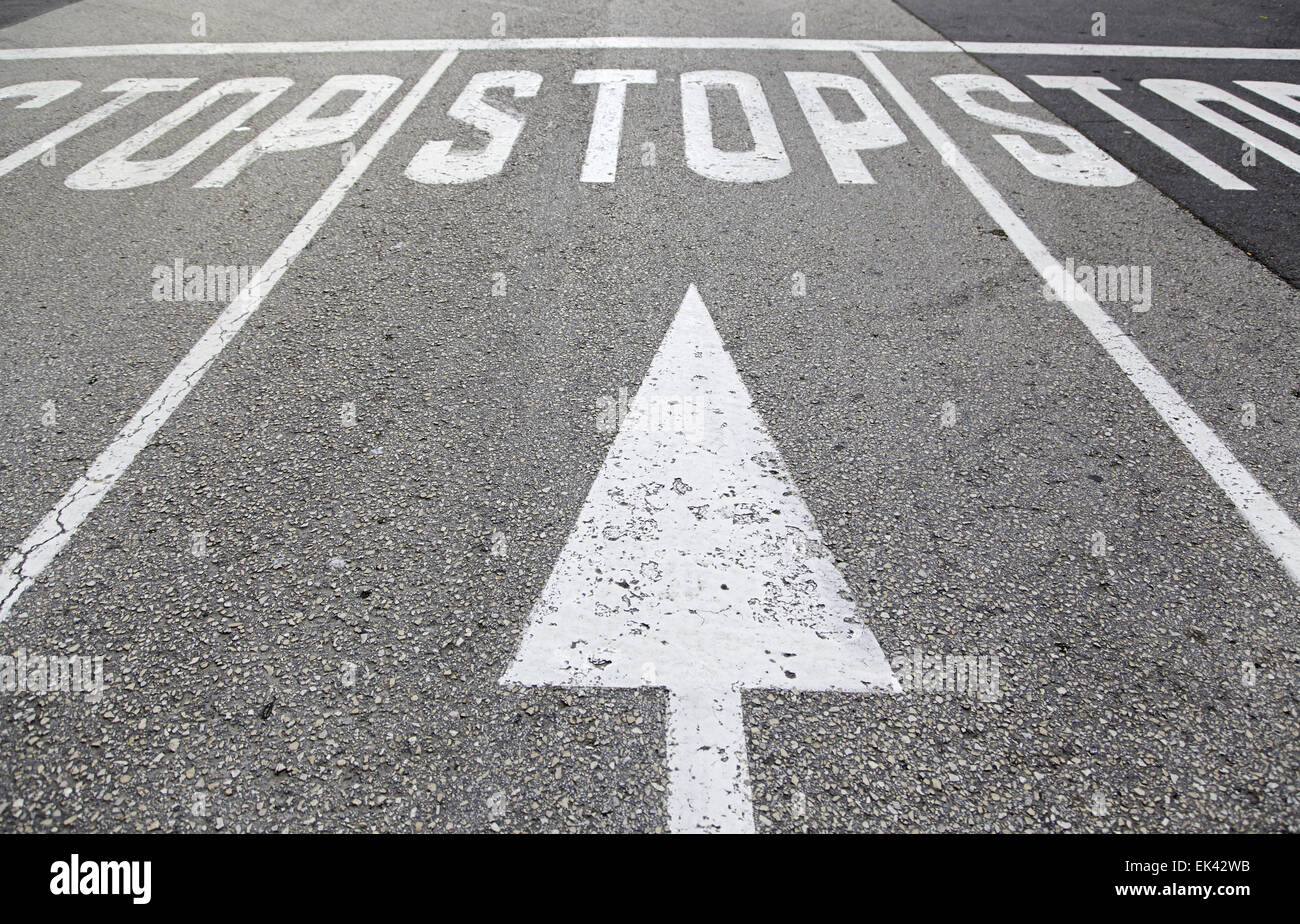 Stop sign on asphalt, detail of a traffic signal Stock Photo - Alamy