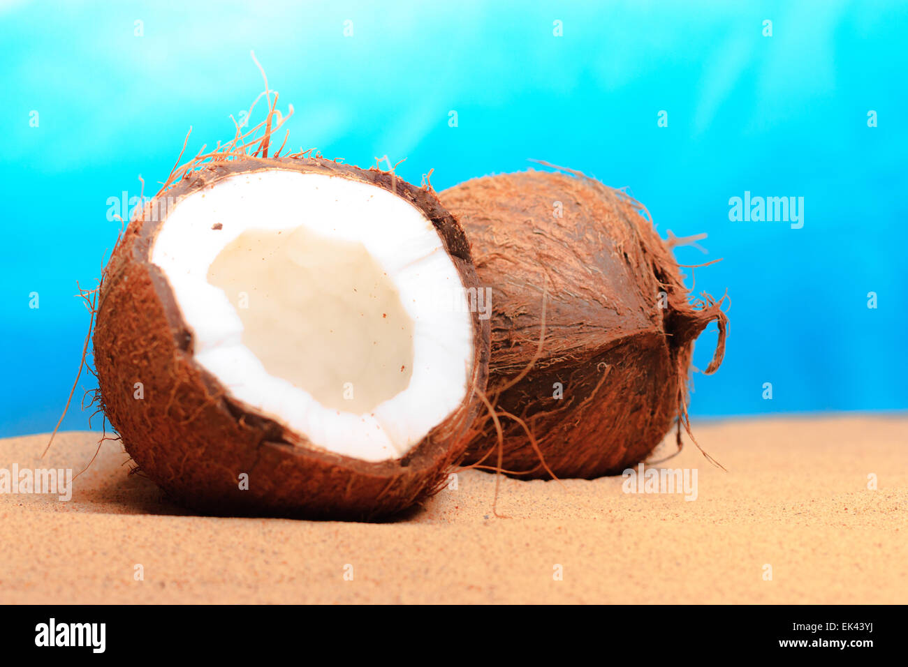 chopped coconut on sea-beach background Stock Photo - Alamy