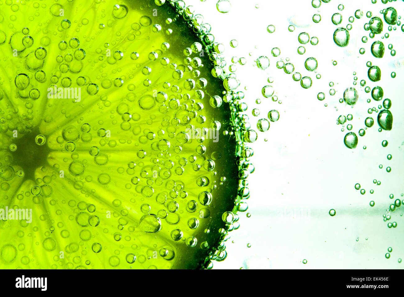 Green lime with water splash Stock Photo - Alamy