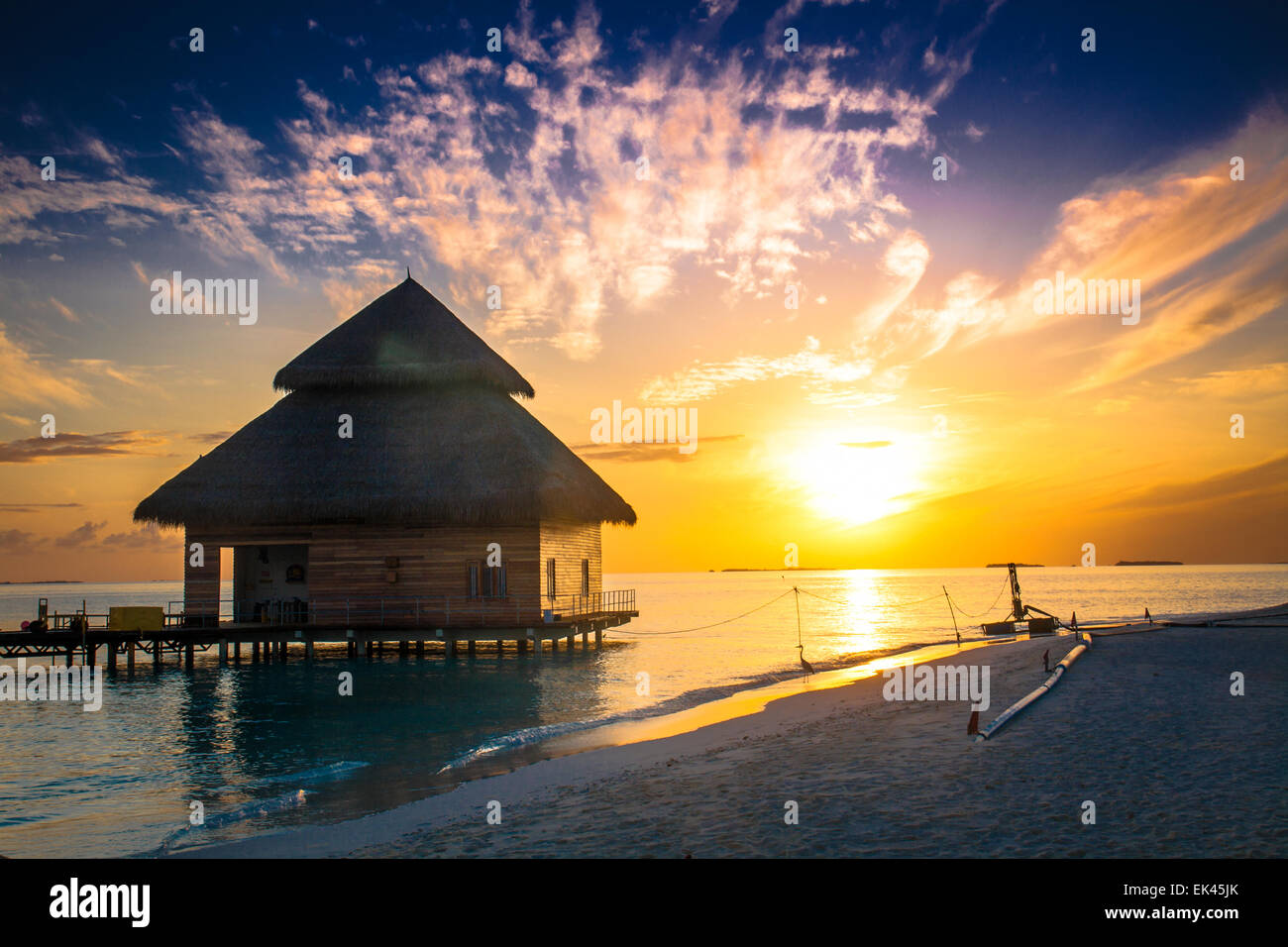 Sunset on Maldives island Stock Photo - Alamy