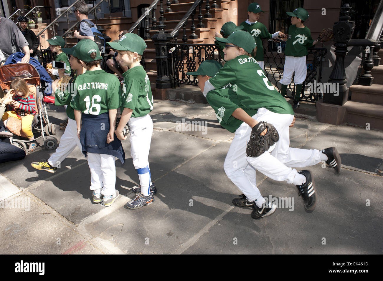 Team members await the start of the 2012 Little League Opening Day ...