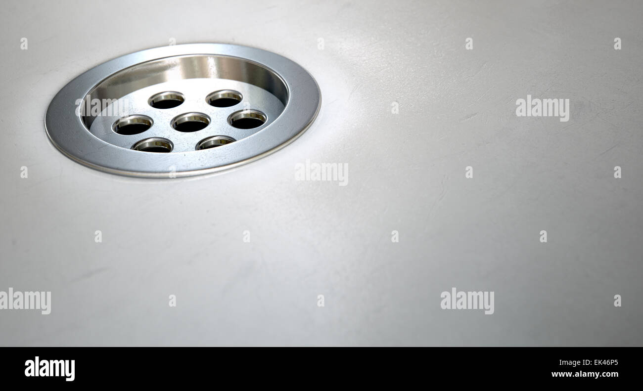 A closeup of a chrome plug hole set in a porcelain basin Stock Photo ...