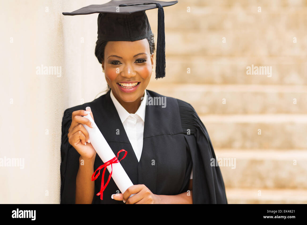 portrait of African female graduate standing outdoors Stock Photo - Alamy