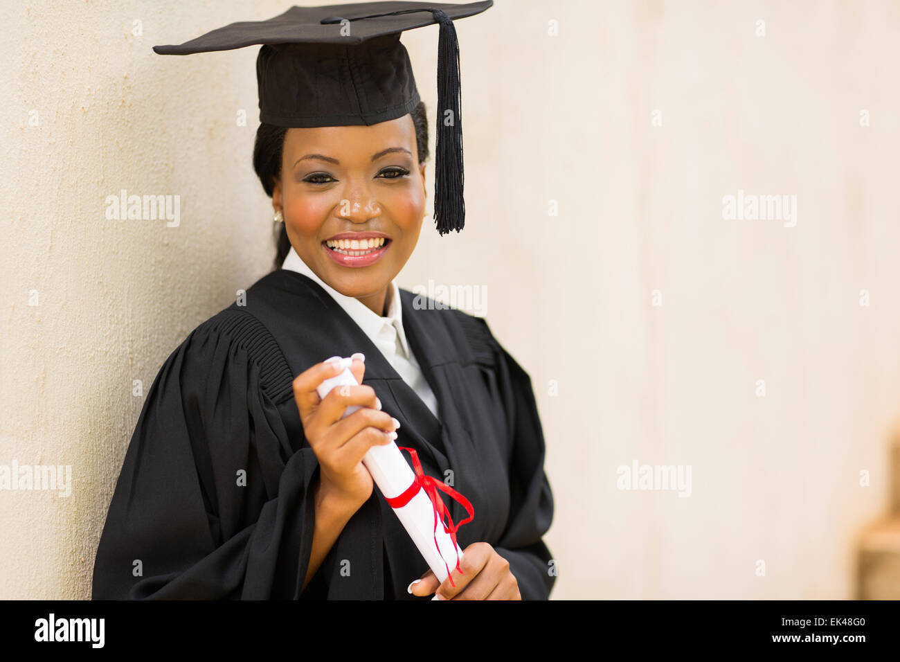 attractive African female graduate holding diploma Stock Photo - Alamy