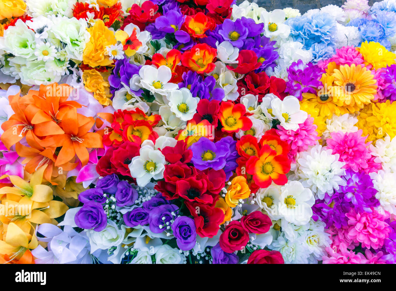 A brilliant colourful display of artificial flowers Stock Photo - Alamy