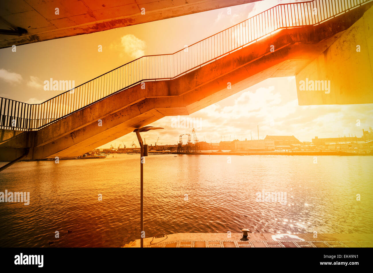 Sunset over harbor, industrial background Stock Photo - Alamy