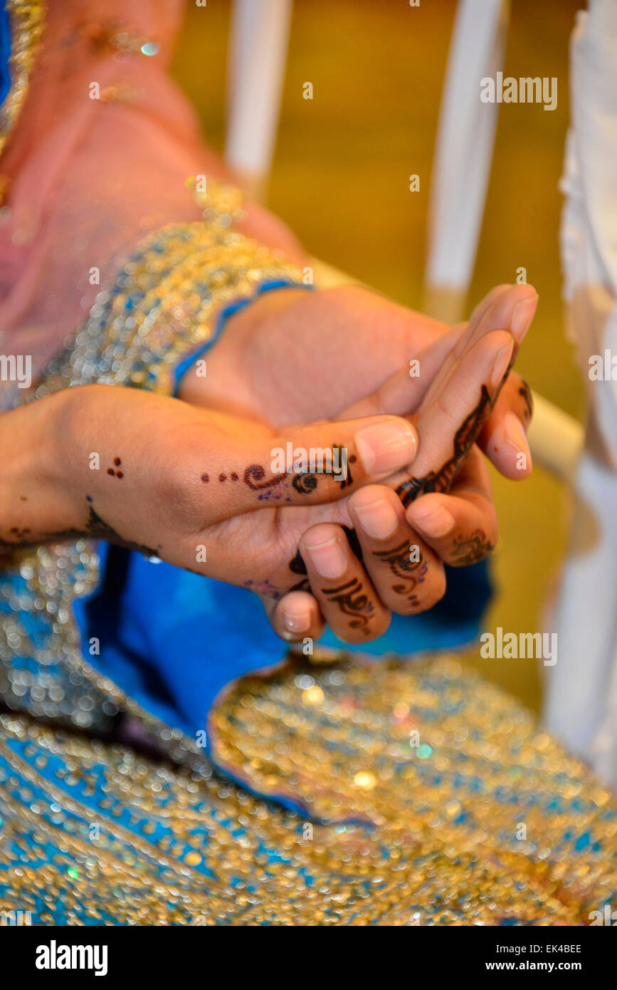 A young lady holds her hands in prayer after the formal announcement of ...