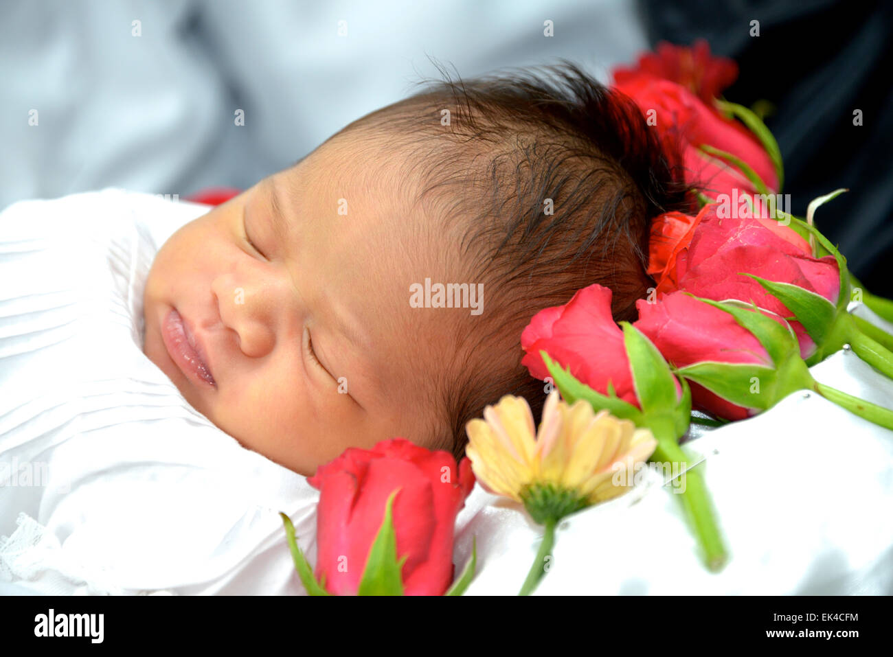A newborn baby ready for the muslim name giving ceremony officiated by ...