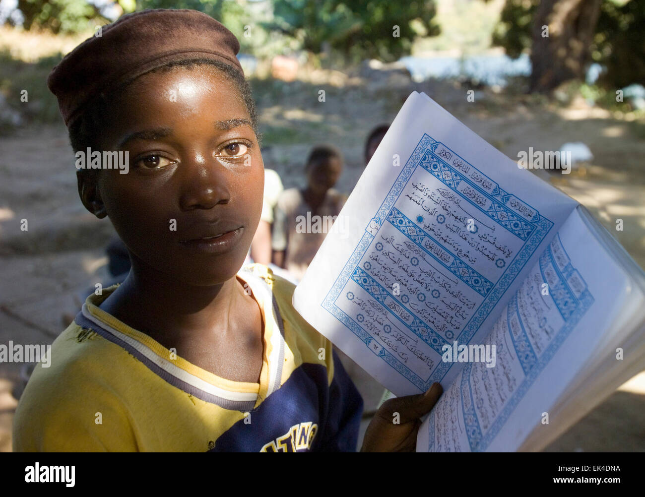 A Malawian Muslim Boy with a book of Quranic verses in Nkhata Bay in ...