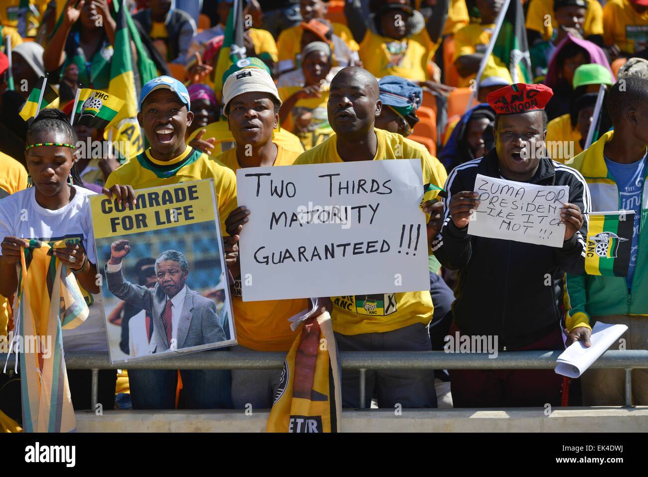 an anc member holds a poster ANC siyanqoba 2014 - The final rally that ...