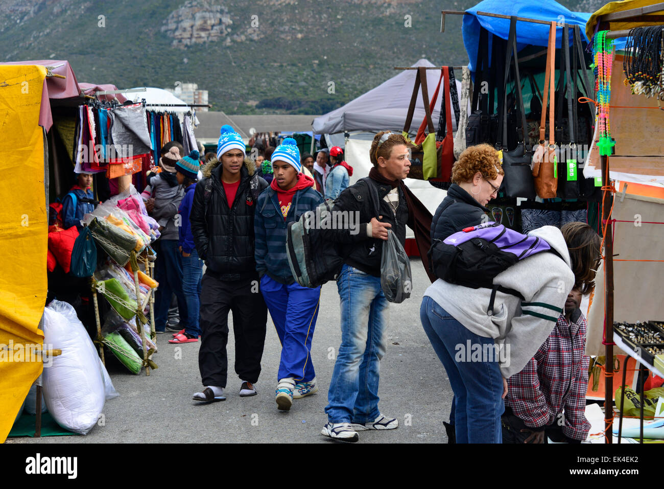 People frequent Muizenberg Flea market which is held every Sunday next to Sunrise beach Stock ...