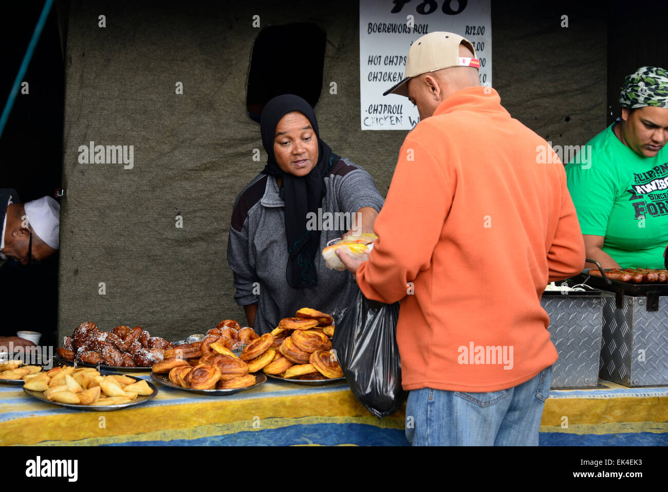 People buying take aways at Muizenberg Flea market which is held every Sunday next to Sunrise ...