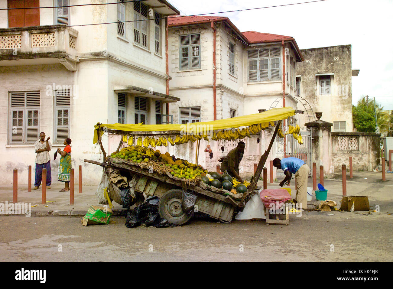 A fruit and vegetable hawker on the side of the road in Mombasa, Kenya ...