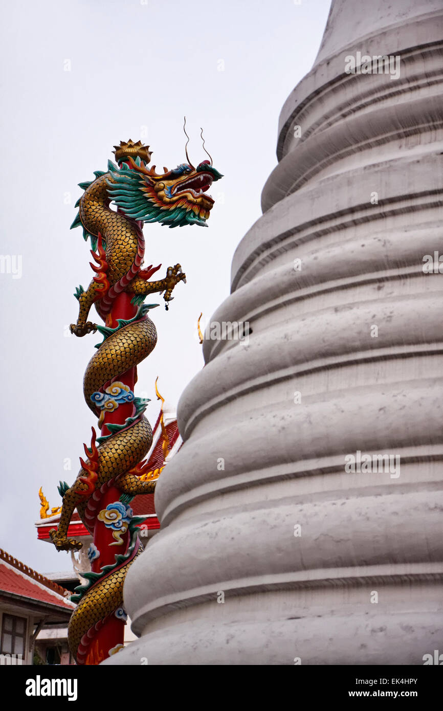 Thailand, Bangkok, a religious dragon statue close to a buddhist temple ...