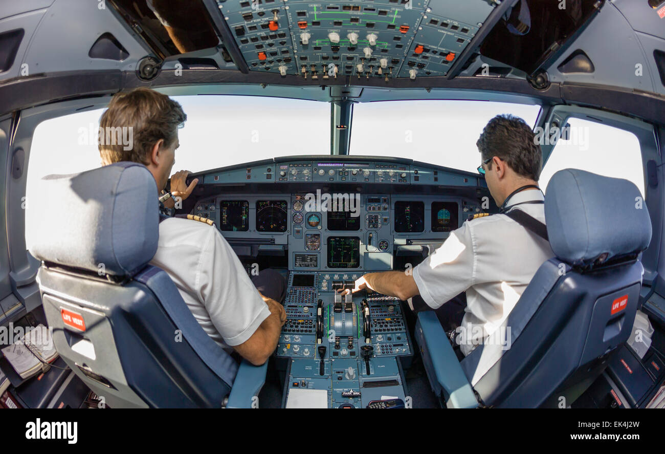 Pilots in an airplane cockpit Stock Photo - Alamy