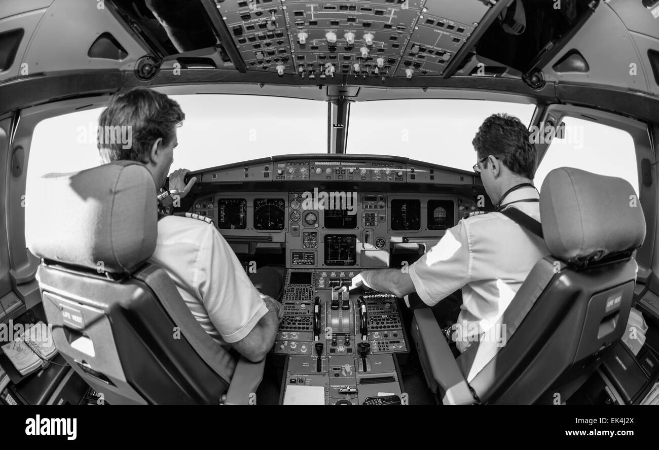 Pilots in an airplane cockpit Stock Photo - Alamy