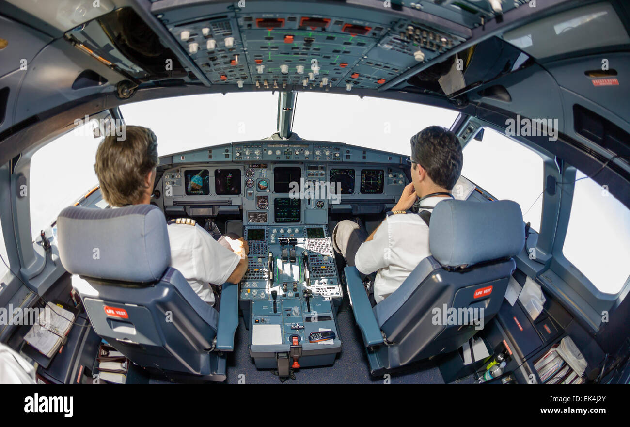 Pilots in an airplane cockpit Stock Photo - Alamy