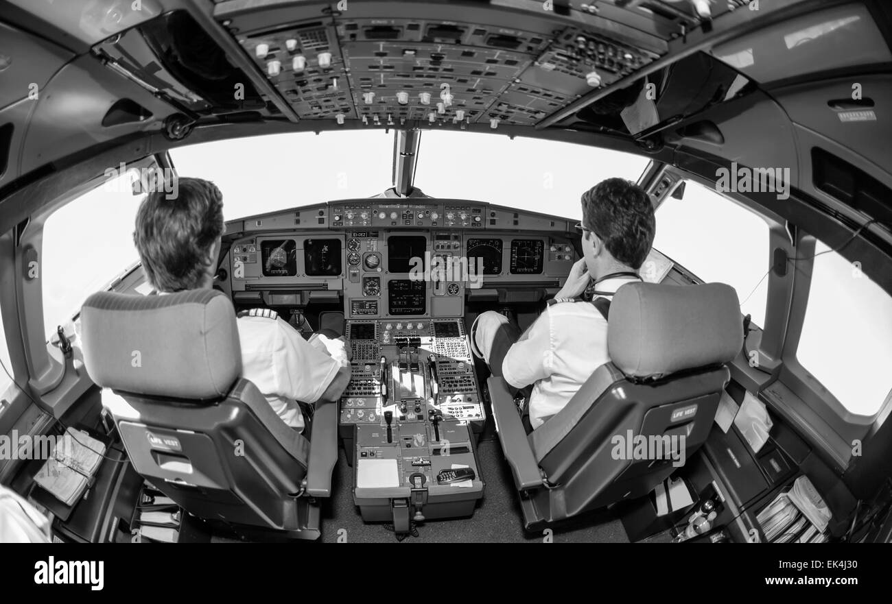 Pilots in an airplane cockpit Stock Photo - Alamy
