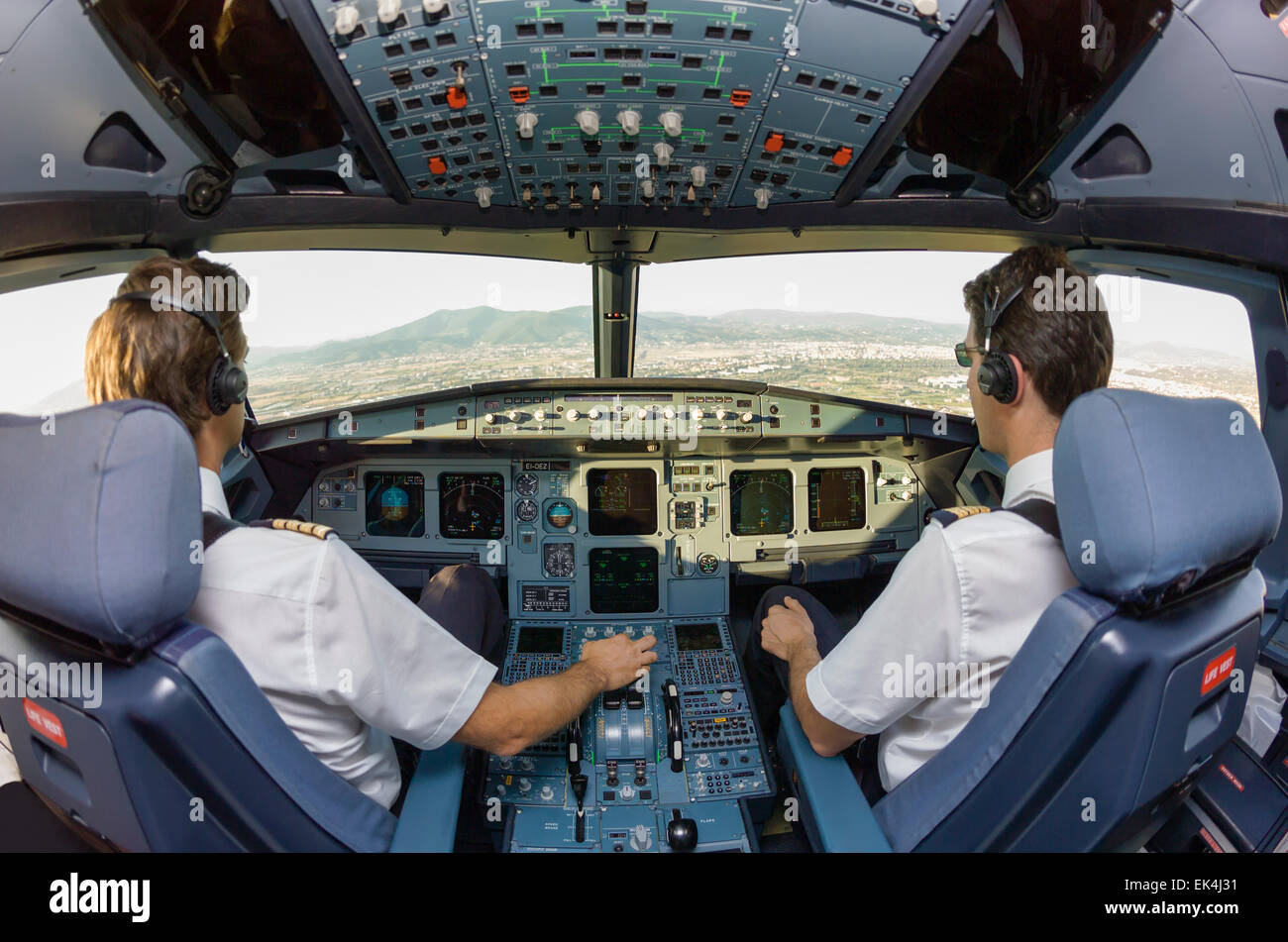 Pilots in an airplane cockpit Stock Photo - Alamy