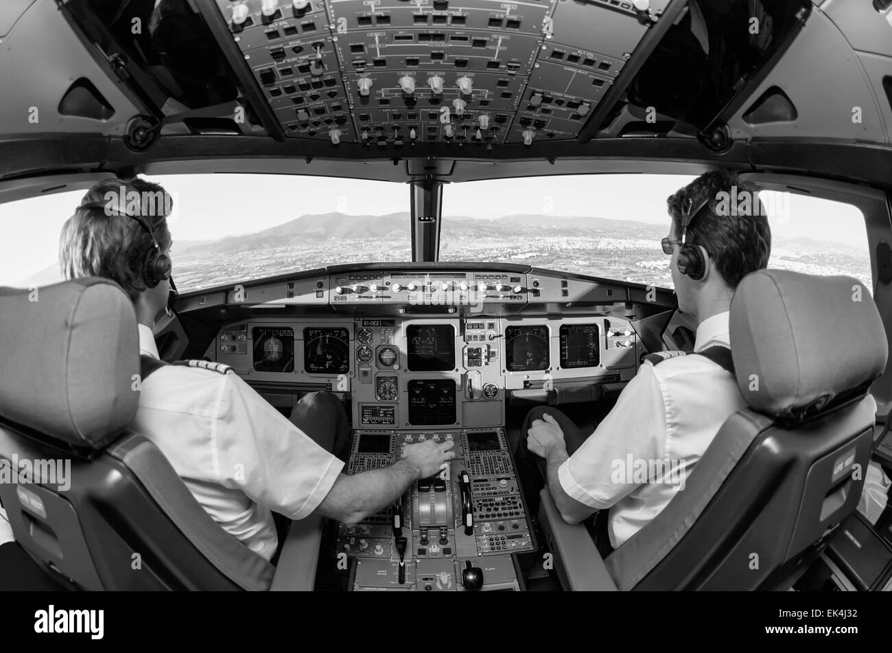 Pilots in an airplane cockpit Stock Photo - Alamy