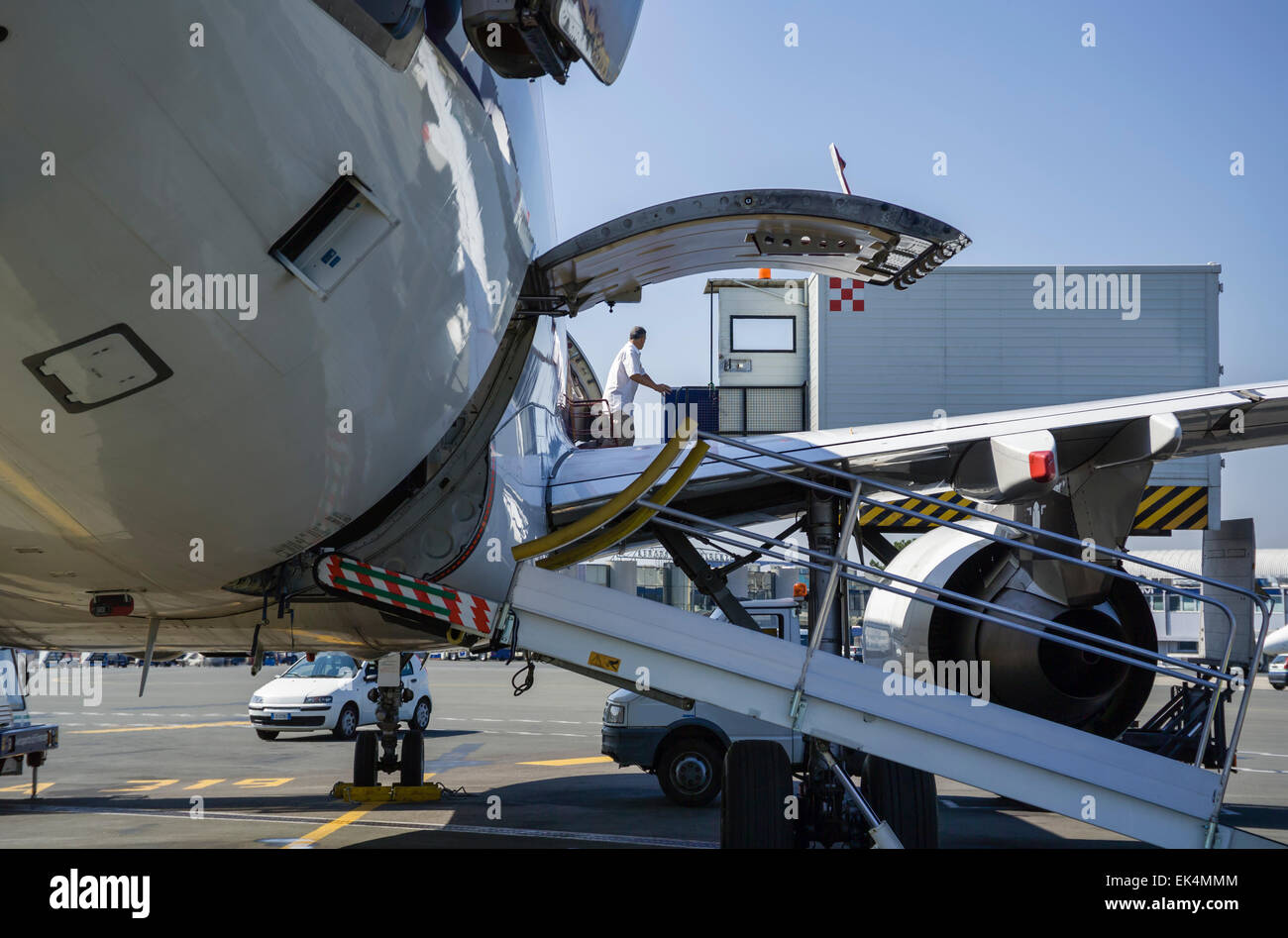 Italy, Tuscany, Florence International Airport, airplane being loaded ...