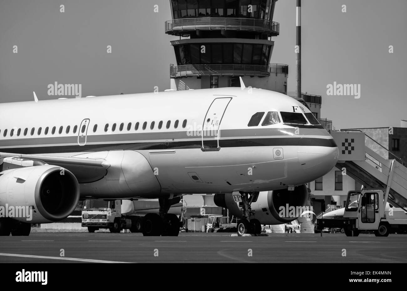 Italy, airplane on the runway and flight control tower (Florence ...