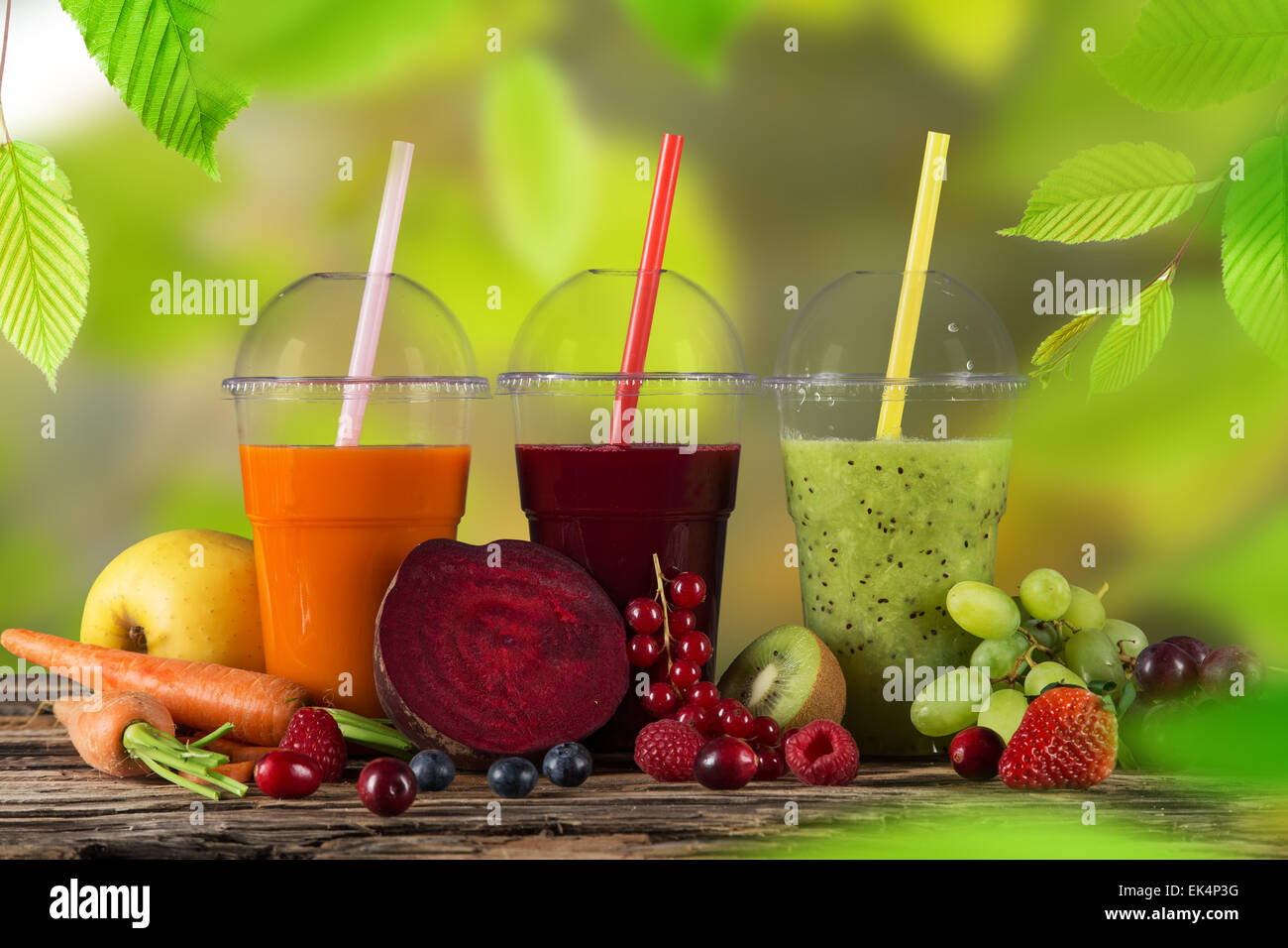 Fresh juice mix fruit, healthy drinks on wooden table Stock Photo - Alamy