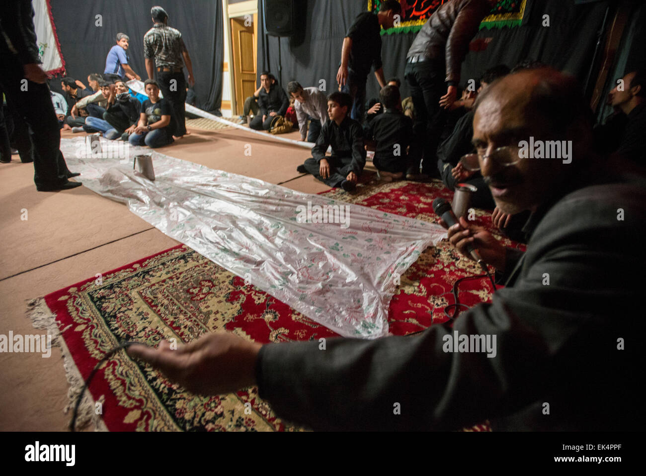 Participants of Tazieh, ritual theater of the day of Ashura, eat beryun ...