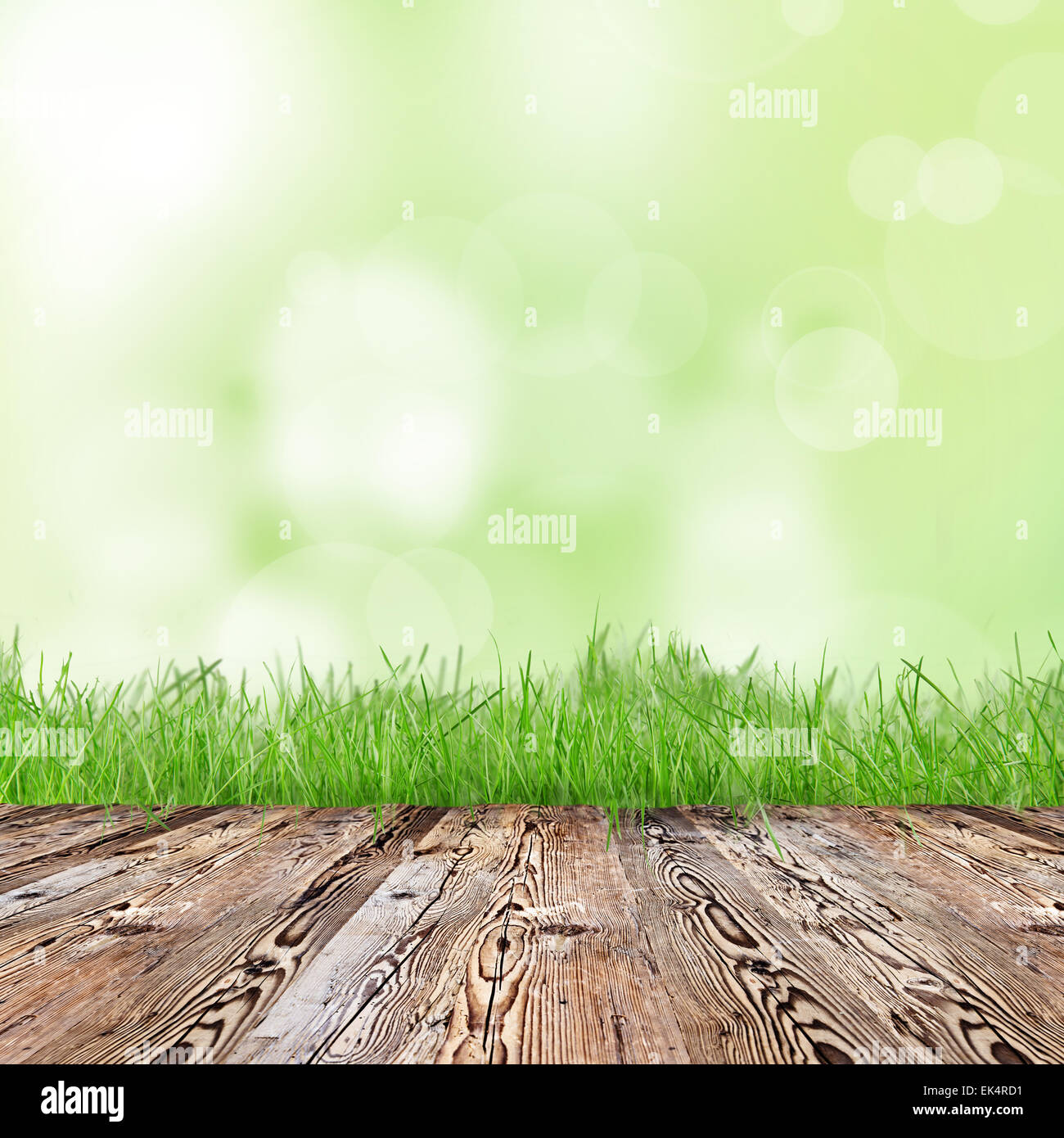 Fresh green grass with wooden desk Stock Photo - Alamy