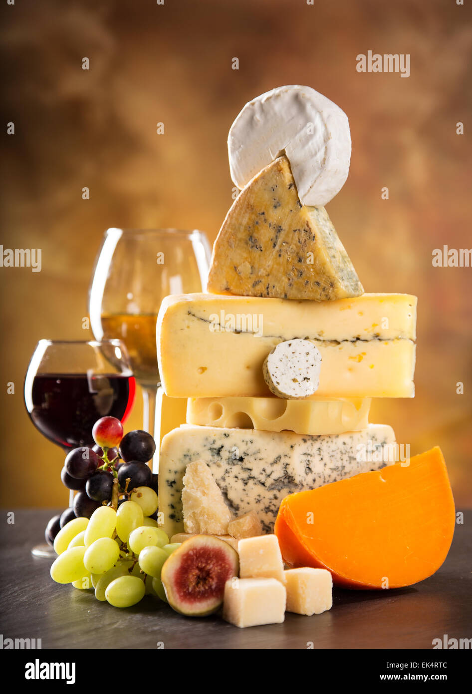 Various types of cheese on stone table, still-life Stock Photo - Alamy