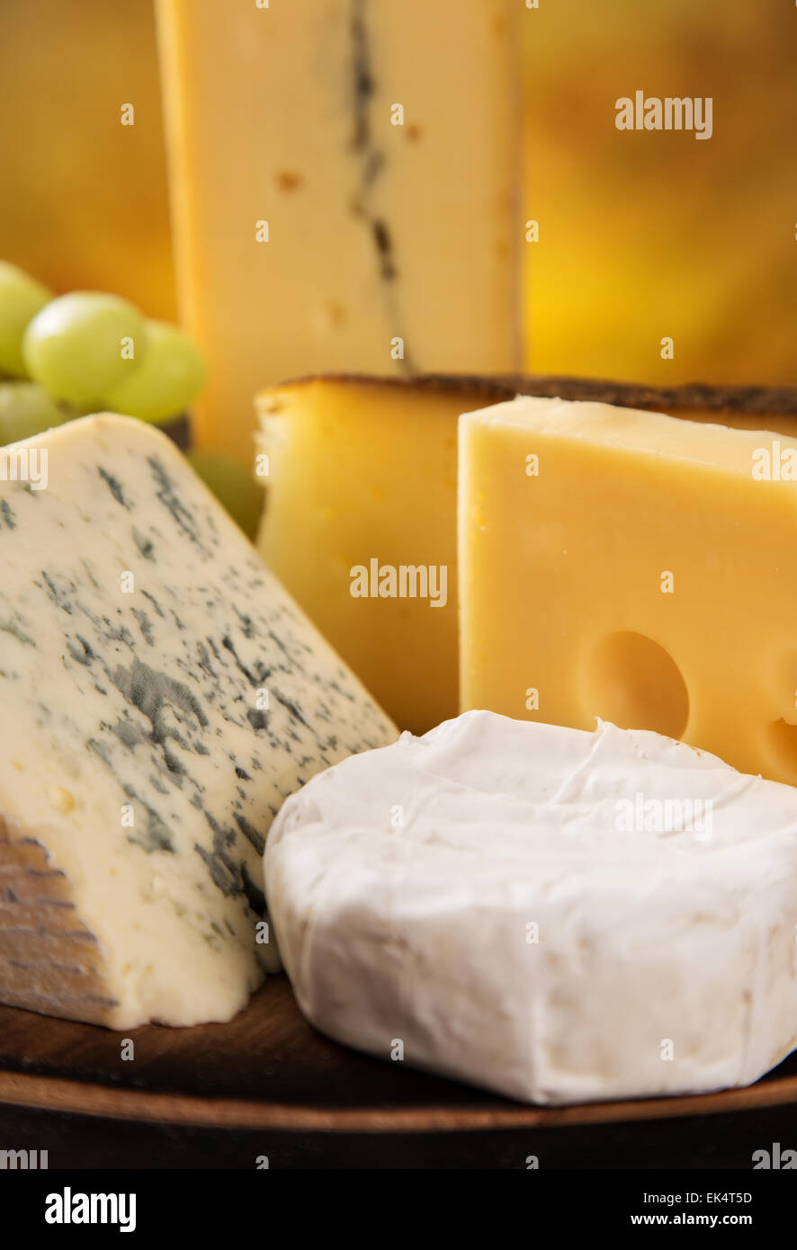 Various types of cheese on stone table, still-life Stock Photo - Alamy