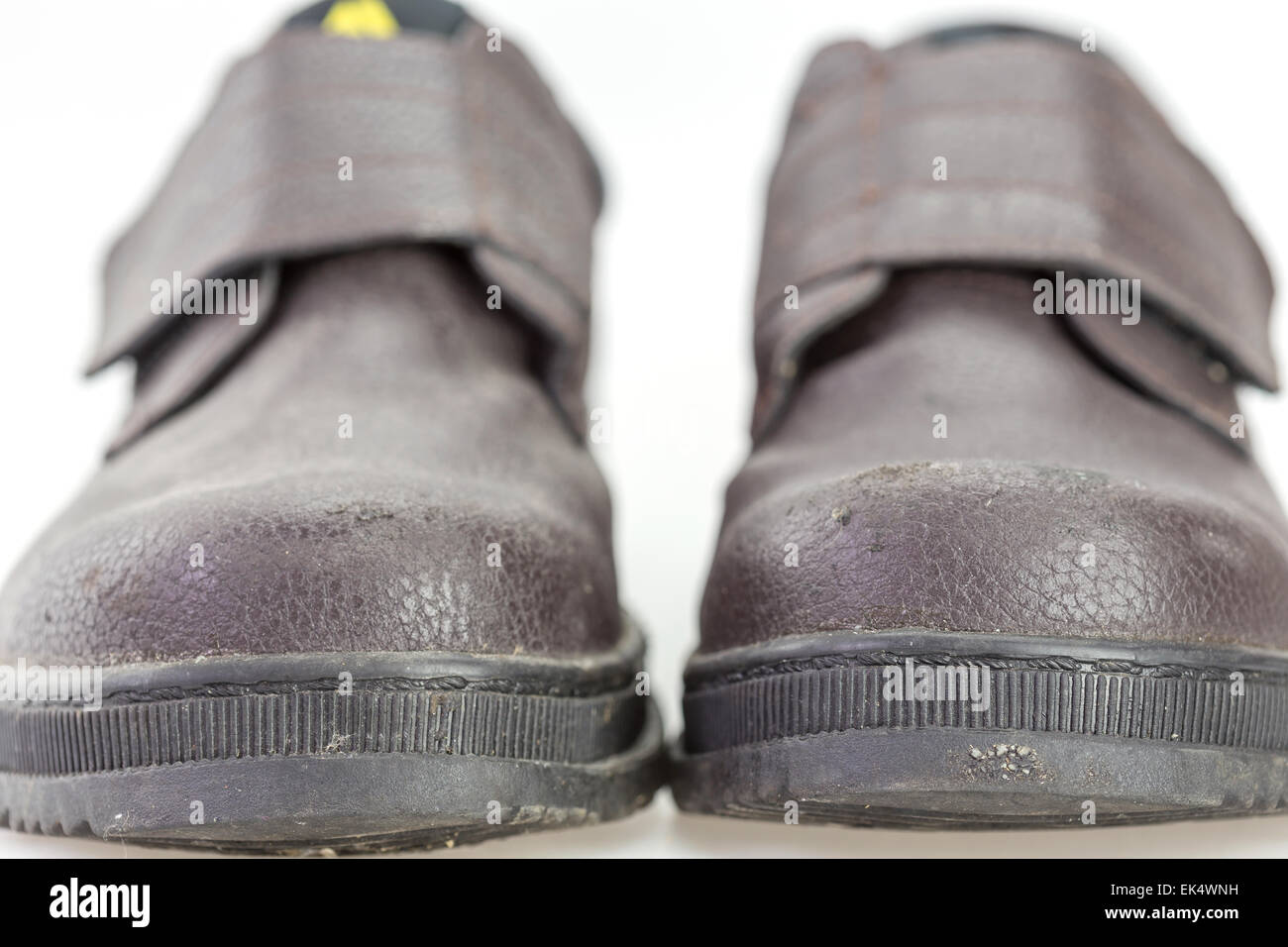 Old black safety shoe for worker isolated on white background Stock ...