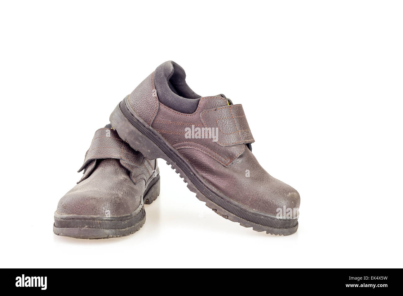 Old black safety shoe for worker isolated on white background Stock ...