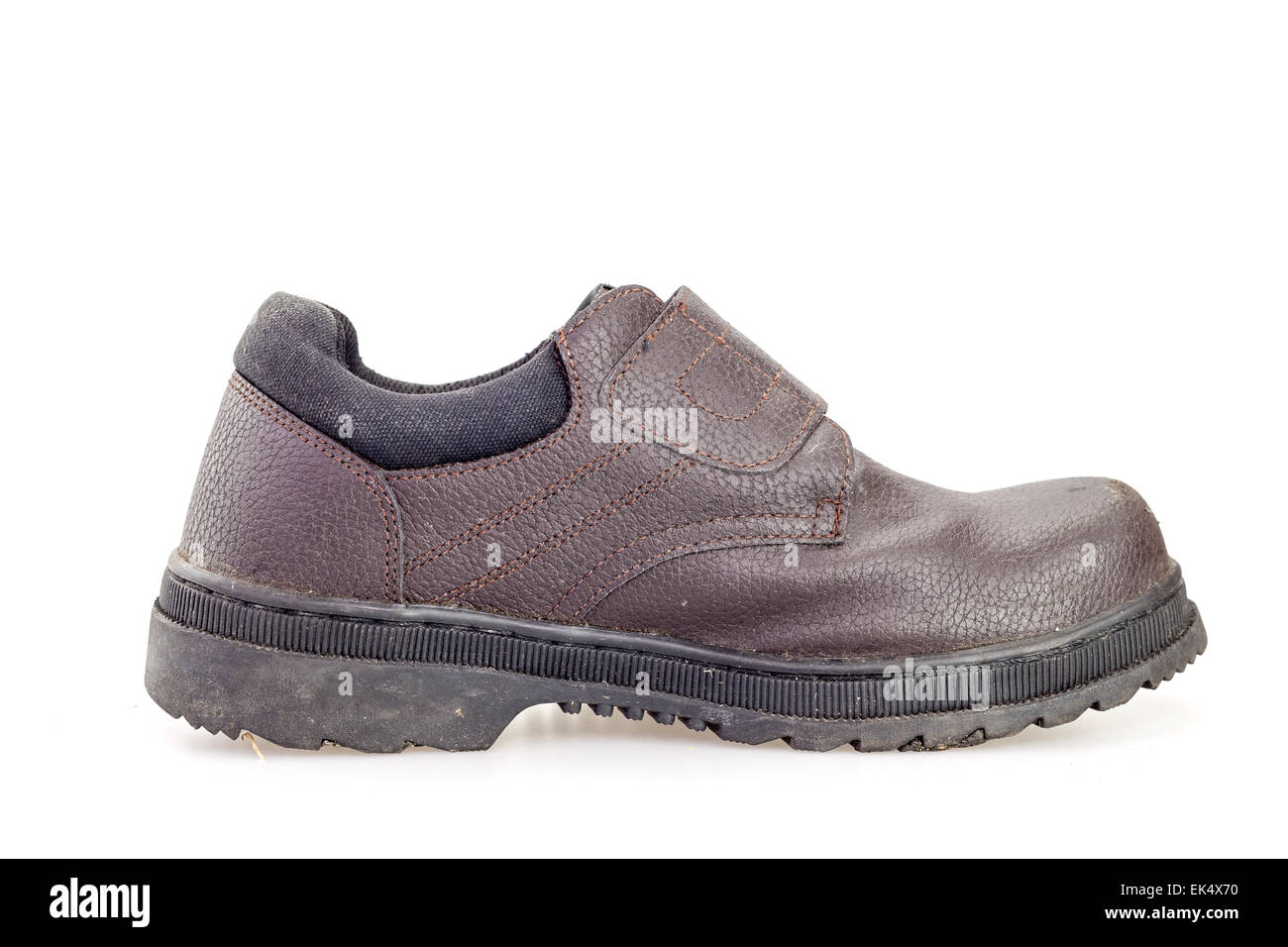 Old black safety shoe for worker isolated on white background Stock ...
