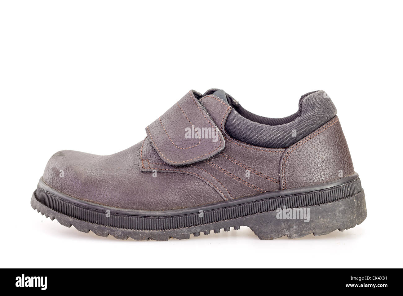 Old black safety shoe for worker isolated on white background Stock ...