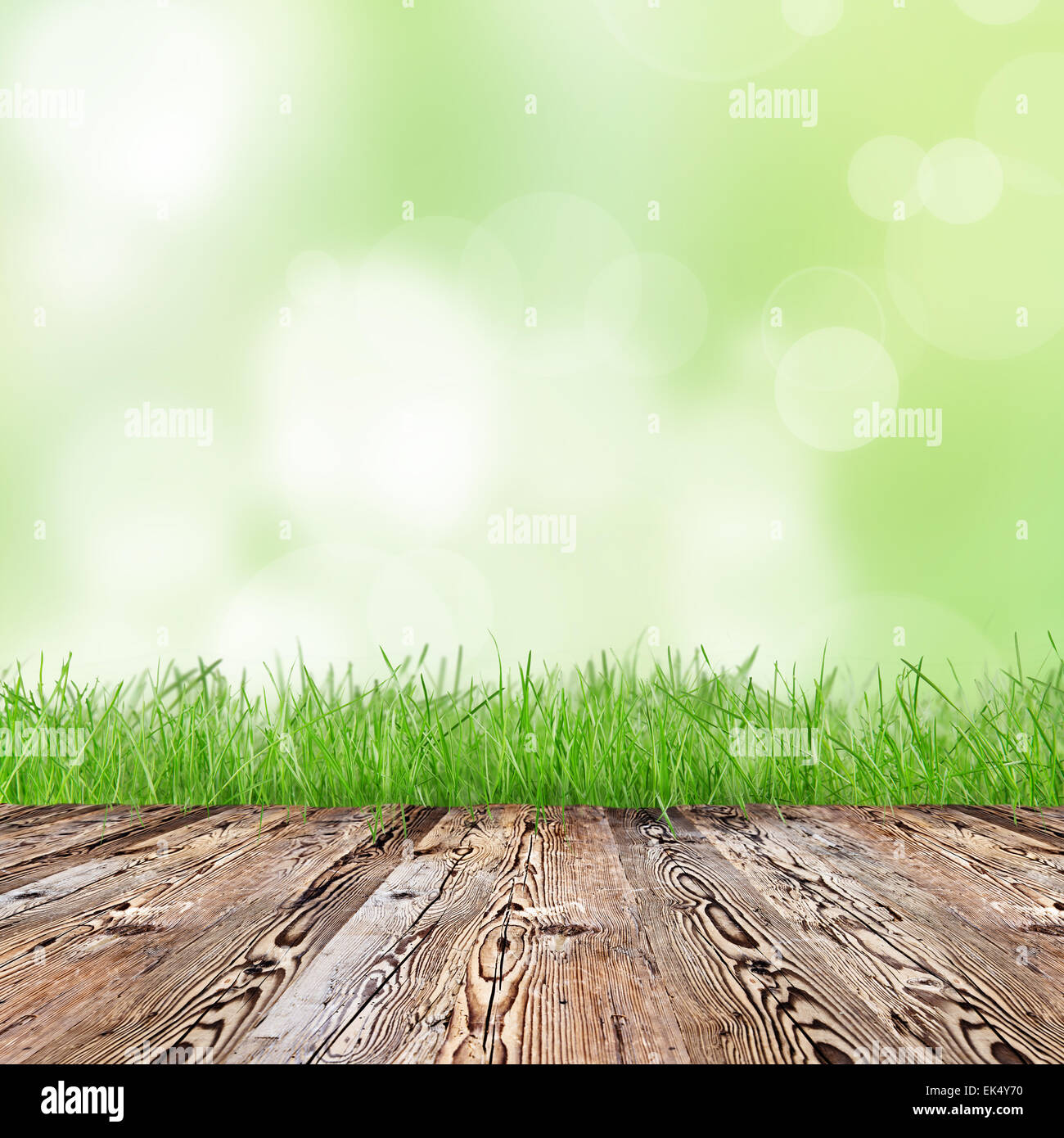 Fresh green grass with wooden desk Stock Photo - Alamy