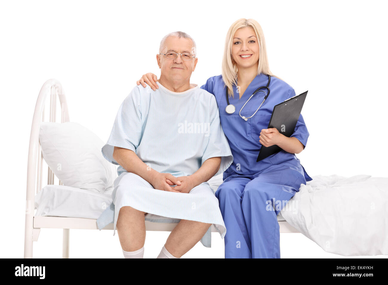 Female doctor hugging a mature patient seated in a hospital bed ...