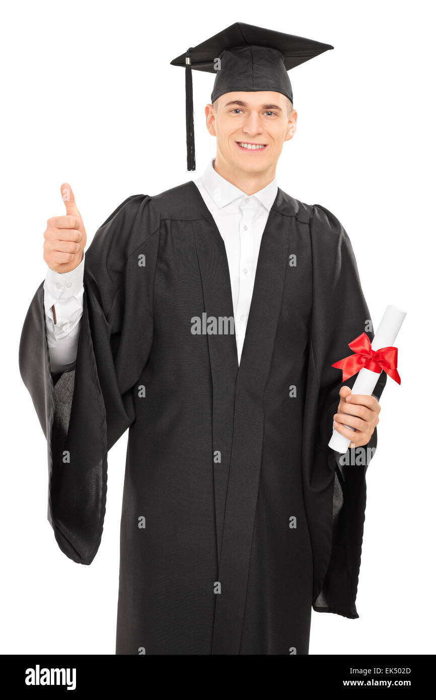 Proud young college graduate in a graduation gown holding a diploma and ...