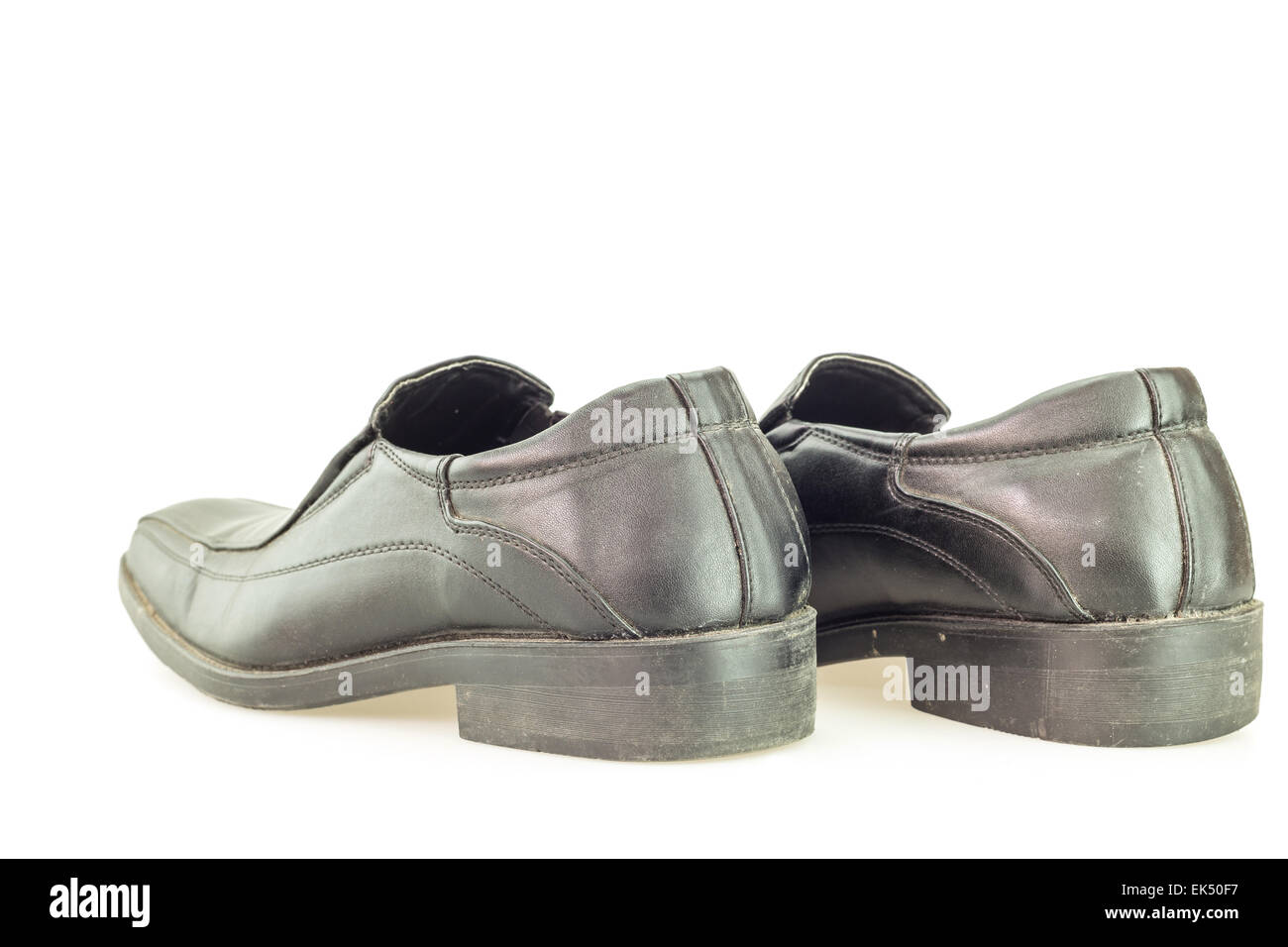 Old black man's shoes isolated on white background Stock Photo - Alamy