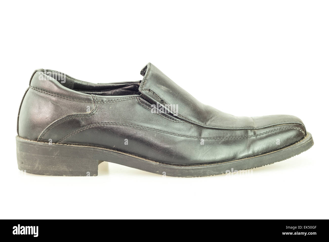 Old black man's shoes isolated on white background Stock Photo - Alamy