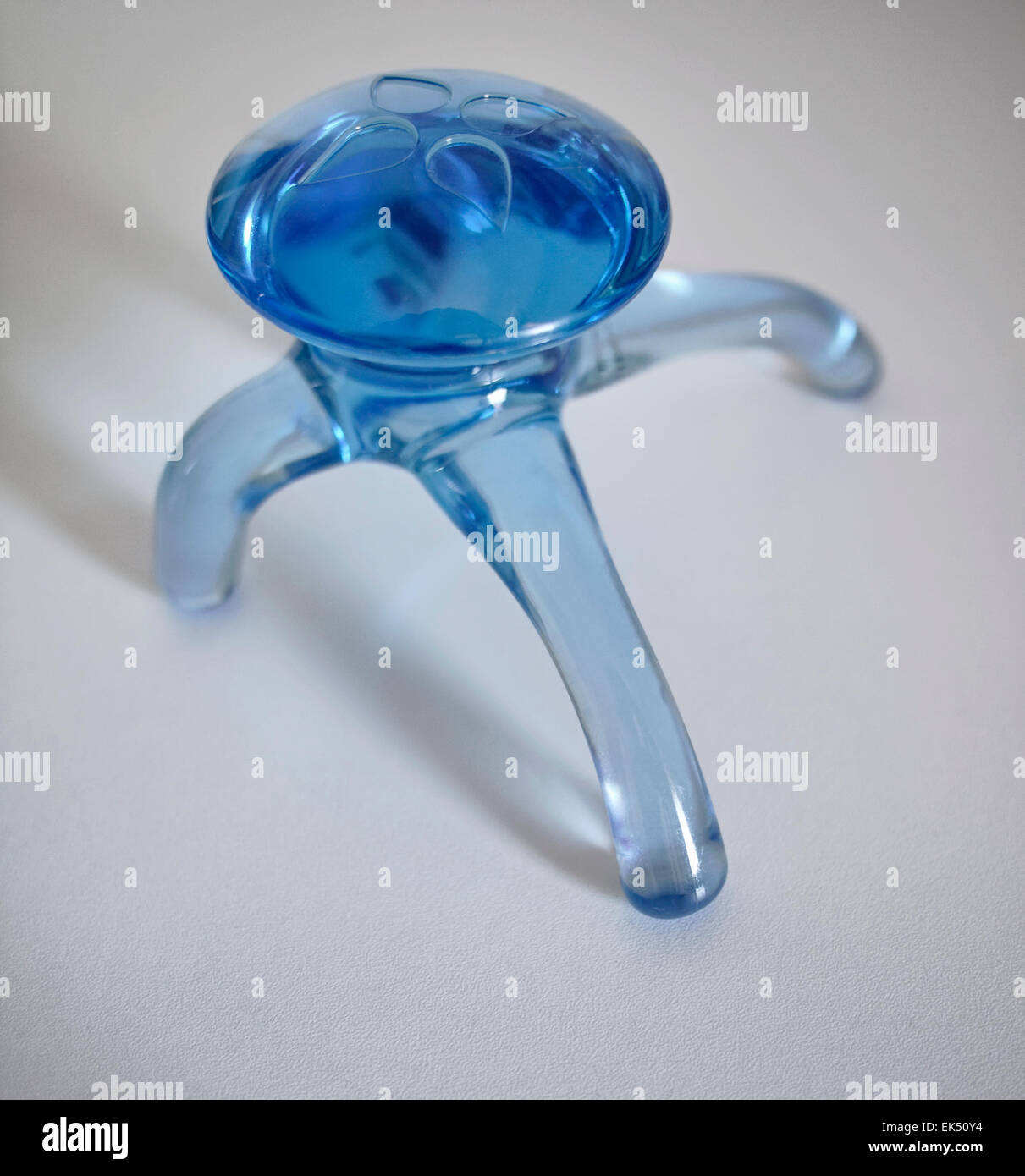 Blue plastic tool for massaging Stock Photo - Alamy