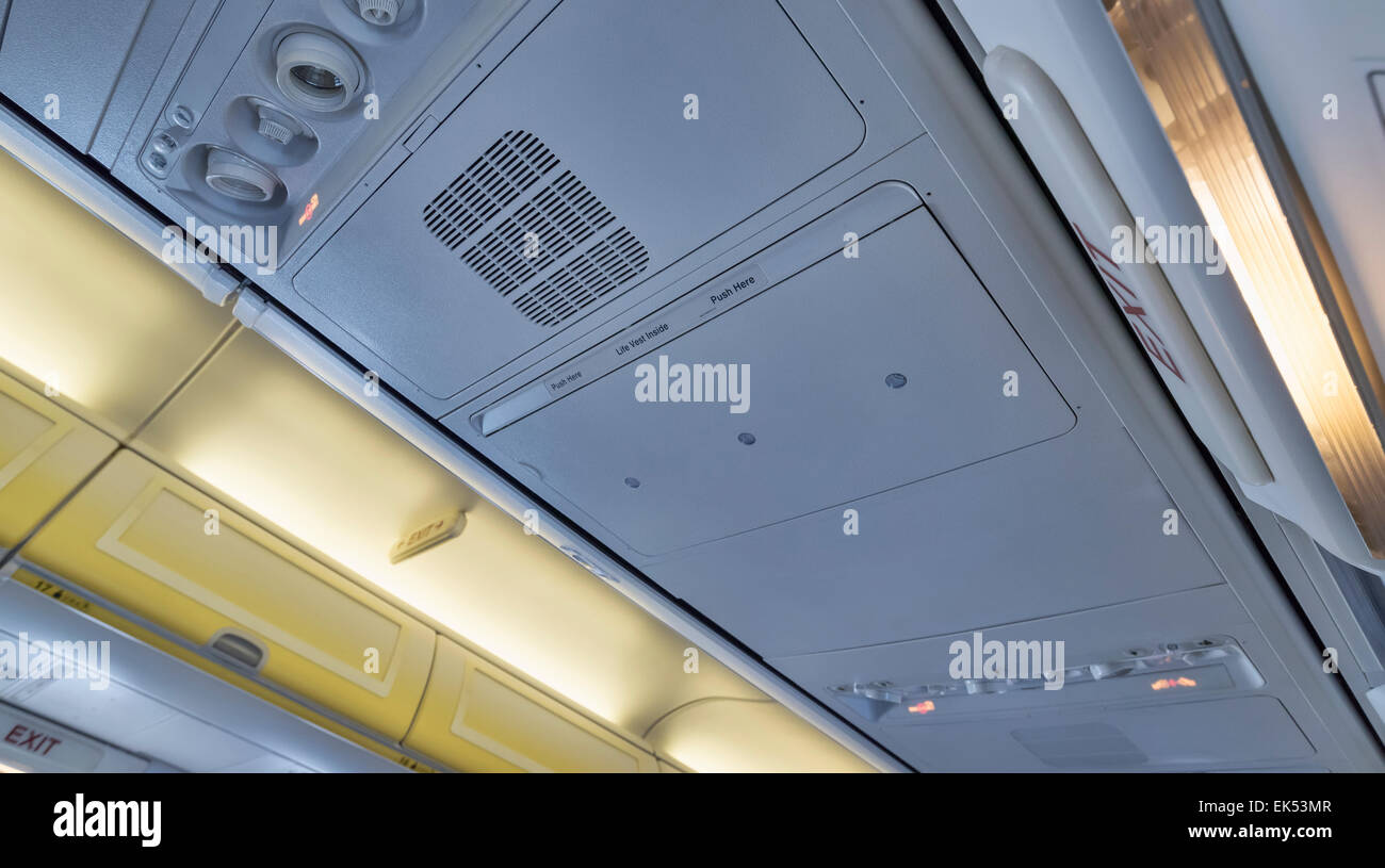Italy, airplane cabin, emergency exit light Stock Photo - Alamy
