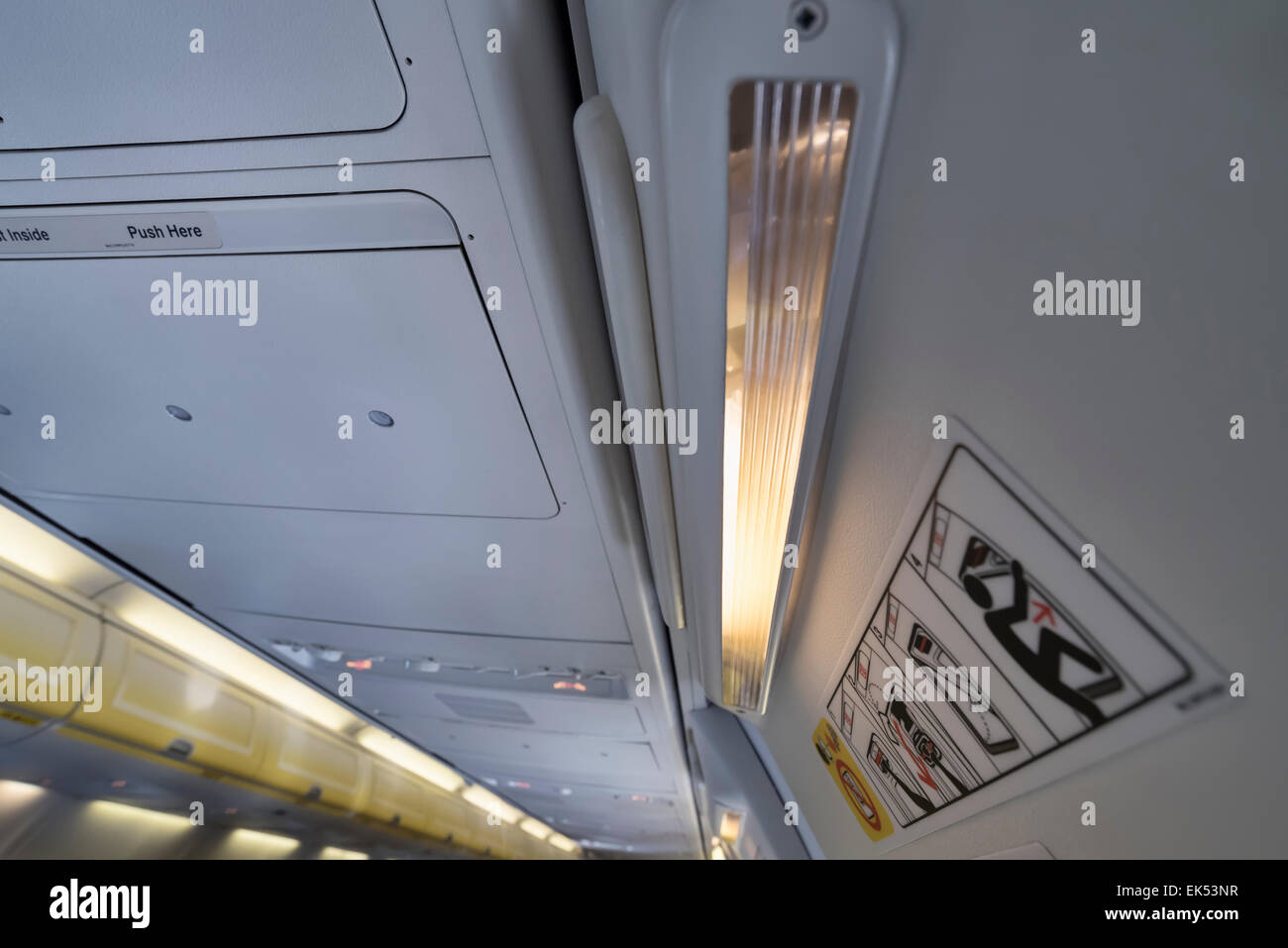 Italy, airplane cabine, emergency exit light Stock Photo - Alamy