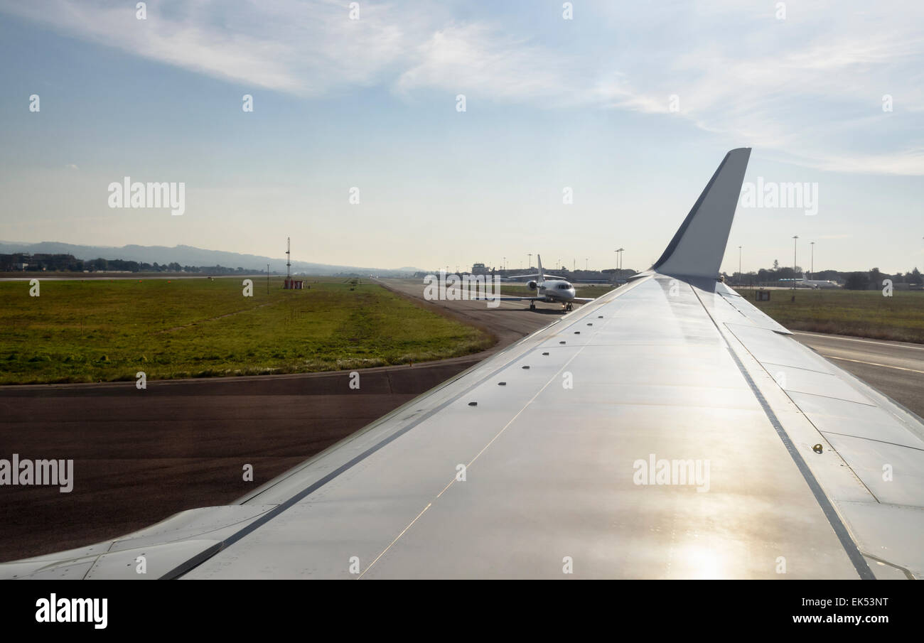Italy, airplane on an airport landing strip Stock Photo - Alamy