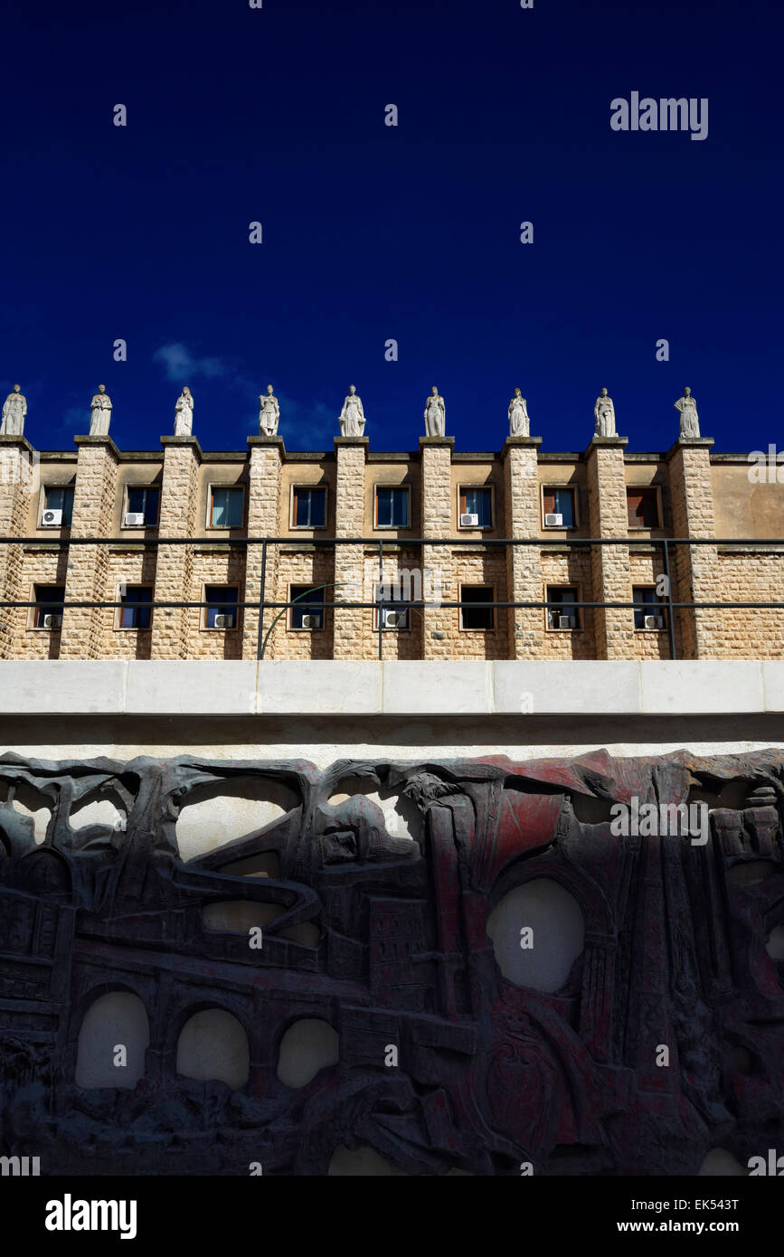 Italy, Sicily, Ragusa, statues on the roof of a fascist building Stock ...